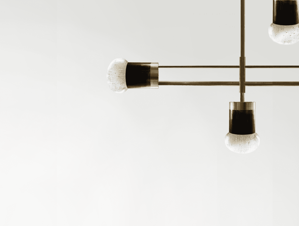 The Kinet pendant light – brass and blown glass diffusers.